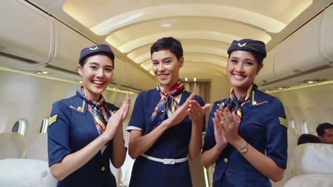 Cabin crew clapping hands in airplane | Stock Video | Pond5