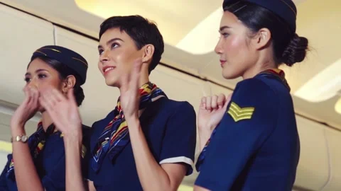 Cabin crew dancing with joy in airplane | Stock Video | Pond5