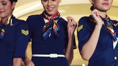 Cabin crew dancing with joy in airplane | Stock Video | Pond5