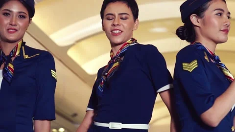 Cabin crew dancing with joy in airplane | Stock Video | Pond5