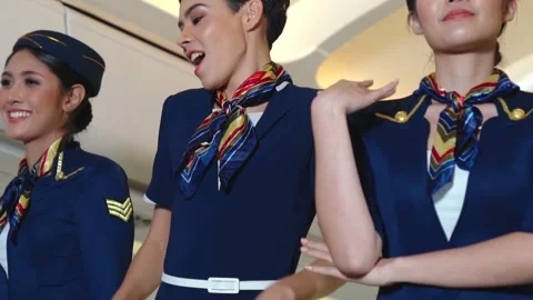 Cabin crew dancing with joy in airplane | Stock Video | Pond5