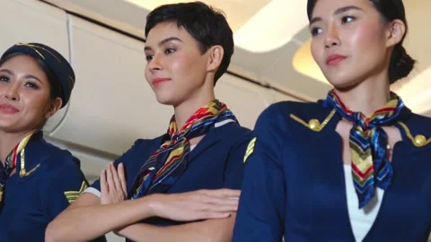 Cabin crew dancing with joy in airplane | Stock Video | Pond5