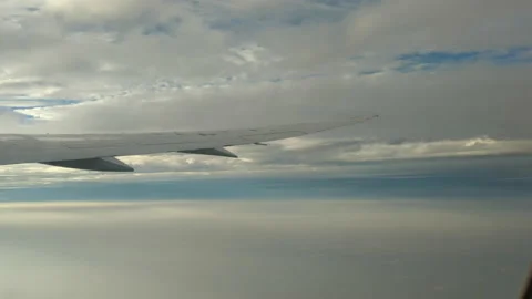 cabin window lookout plane wing clouds i... | Stock Video | Pond5