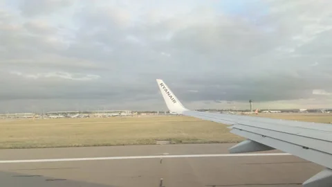 Cabin window view of plane wing Ryanair ... | Stock Video | Pond5