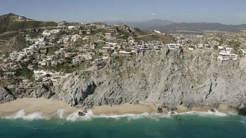 Cabos Mexico beach to houses cliffs dron... | Stock Video | Pond5