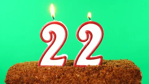 Cake with the number 22 lighted candle. ... | Stock Video | Pond5