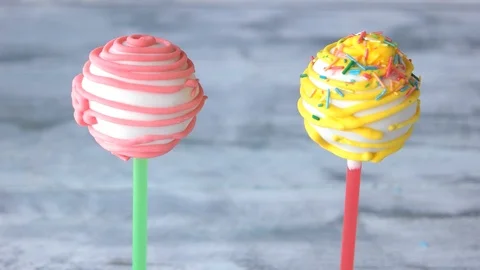 Cake pops with filling on grey backgroun... | Stock Video | Pond5