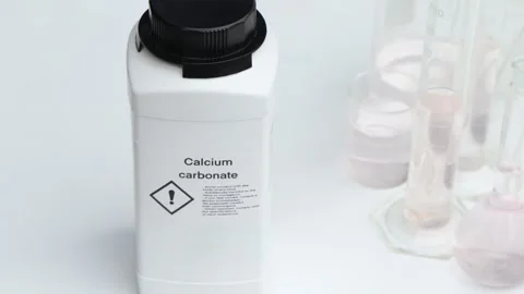 Calcium carbonate in bottle, chemical in... | Stock Video | Pond5