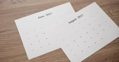 Calendar month sheet for 2023 on table | Stock Video | Pond5