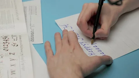 Calligraphy, a man learns to write the l... | Stock Video | Pond5