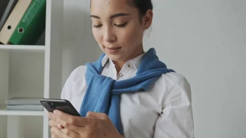 Calm asian woman is writing a message on... | Stock Video | Pond5