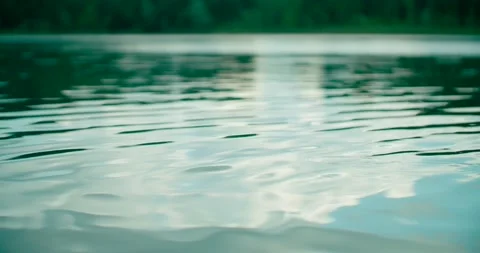 Calm ripple on a lake water surface with... | Stock Video | Pond5