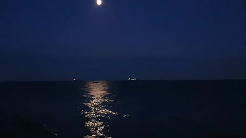 Calm sea under the Moon at night - shot ... | Stock Video | Pond5