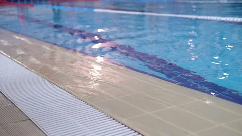 Calm water on empty swimming pool, dark ... | Stock Video | Pond5