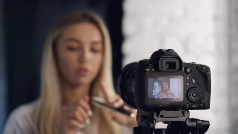 A camera is filming a makeup artist doin... | Stock Video | Pond5