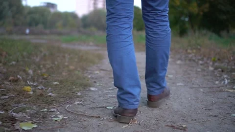 Camera following feet walking. Foot step... | Stock Video | Pond5