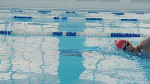 Camera follows strong female swimmer in ... | Stock Video | Pond5