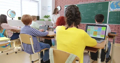 Camera moving from back of classroom to ... | Stock Video | Pond5