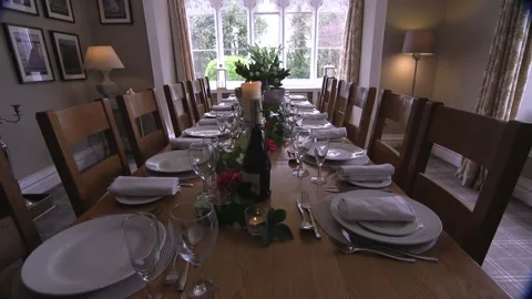 Camera tilt low view along a dining tabl... | Stock Video | Pond5