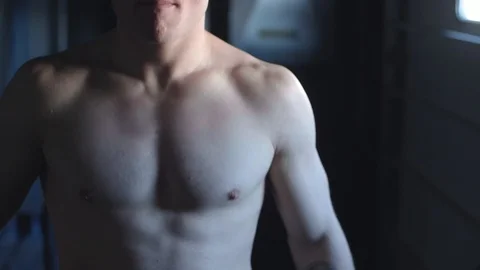 Camera tilts up across the shirtless tor... | Stock Video | Pond5