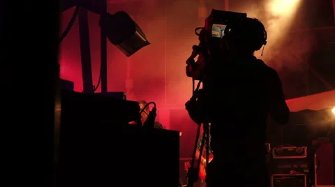 Cameraman filming musicians on a stage i... | Stock Video | Pond5