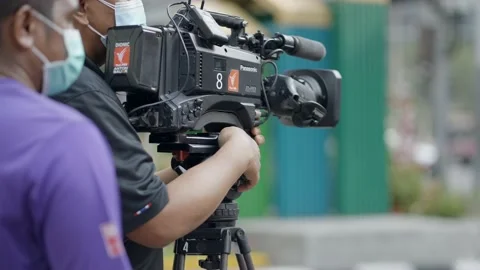 Cameraman Filming An Outdoor Live TV Int... | Stock Video | Pond5