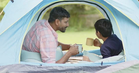 Camping in tent, Indian father and son d... | Stock Video | Pond5
