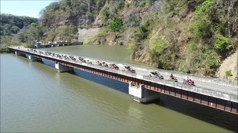 CAN-AM, SIDE-BY-SIDE over bridge, UTV Of... | Stock Video | Pond5