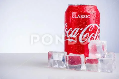 Can of Classic Coca-Cola and ice cubes Stock Image #79709831