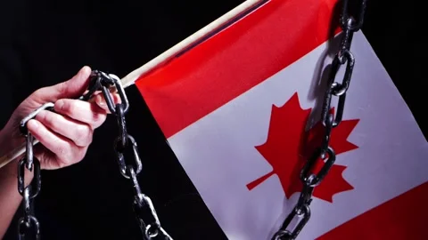Canadian flag in chains on dark backgrou... | Stock Video | Pond5