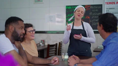 Candid restaurant scene of waitress inte... | Stock Video | Pond5