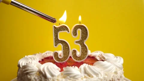 A candle in the form of the number 53 is... | Stock Video | Pond5