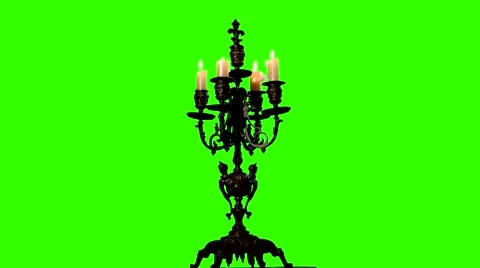 Candle in vintage candlestick on green s... | Stock Video | Pond5