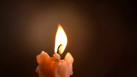 Candles flame blows out on a dark backgr... | Stock Video | Pond5