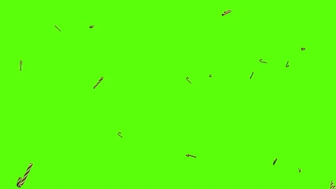 Candy cane exploding over green screen. ... | Stock Video | Pond5