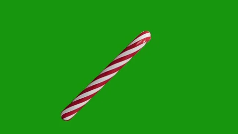 Candy Cane Rotating on Green Background ... | Stock Video | Pond5