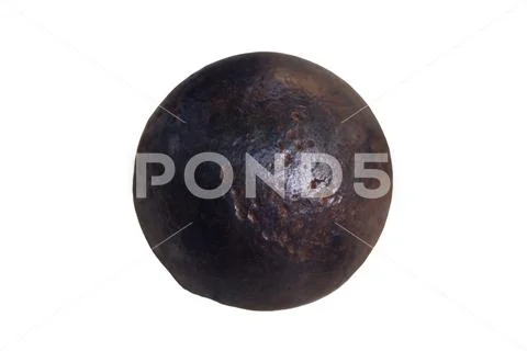 Photograph: Cannonball six-pound close-up, isolated on white background ...