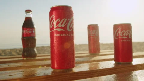 Cans of Coca Cola on a hot summer day on... | Stock Video | Pond5