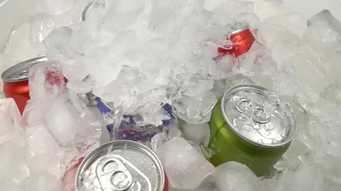 Cans of soft drink in the ice, slow moti... | Stock Video | Pond5