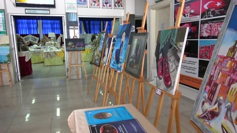 Canvas exhibited in front of art gallery | Stock Video | Pond5