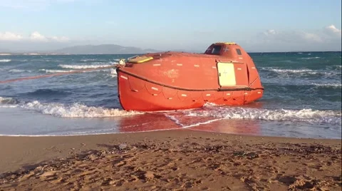 Capsule lifeboat on the seashore after c... | Stock Video | Pond5