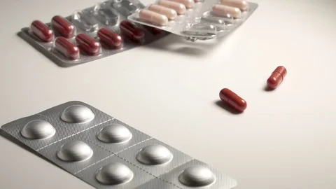capsule tablet falling and bouncing. On ... | Stock Video | Pond5