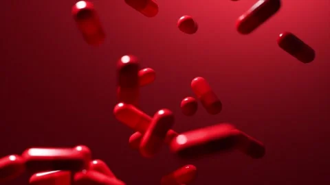 Capsules cascade in 3D on a crimson back... | Stock Video | Pond5