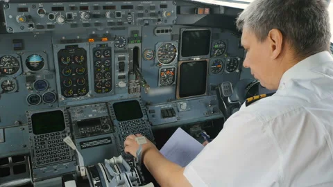 Captain of airplane prepares documents b... | Stock Video | Pond5