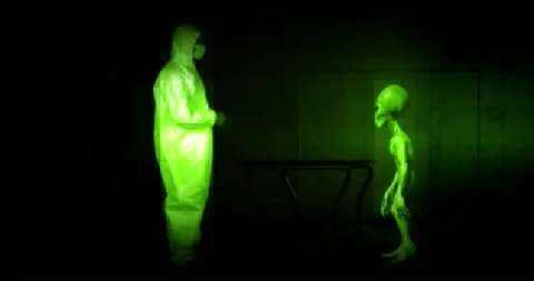 Captured alien being interrogated Night ... | Stock Video | Pond5