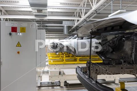 Photograph: Car bodies are on assembly line. Factory for production of ...