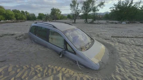 car covered in sand and mud after a natu... | Stock Video | Pond5