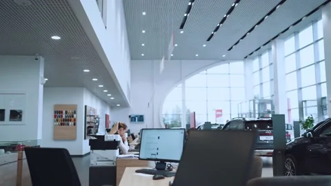 A car dealership manager works at a comp... | Stock Video | Pond5