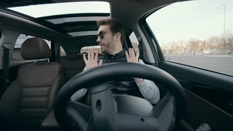Car driving on autopilot while a man sit... | Stock Video | Pond5