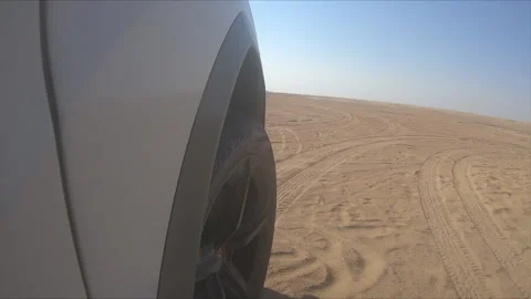 Car is driving in the desert. Camera fro... | Stock Video | Pond5